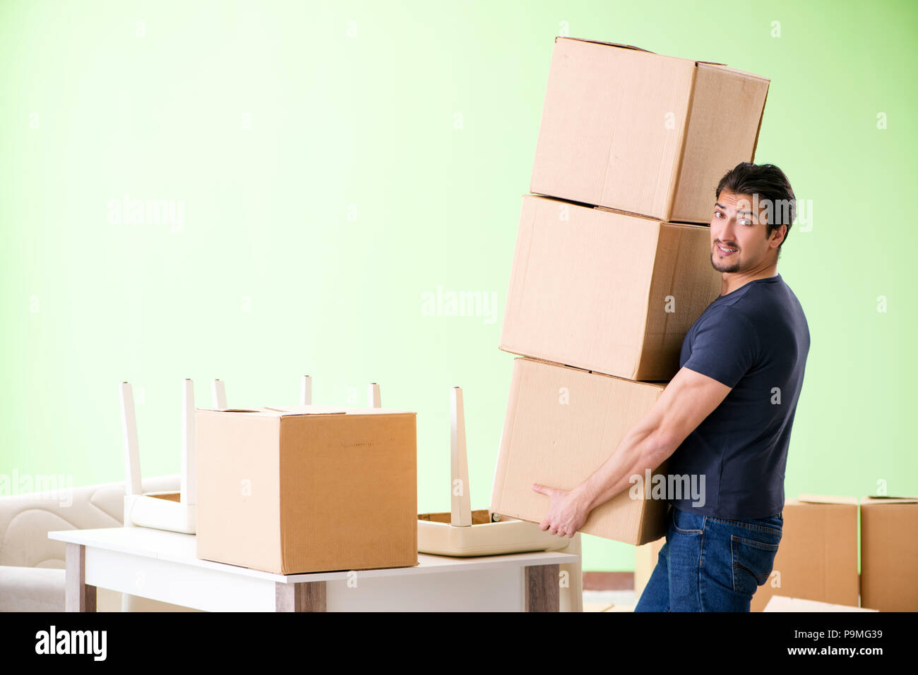 Delivery man falling stack boxes hi-res stock photography and images ...
