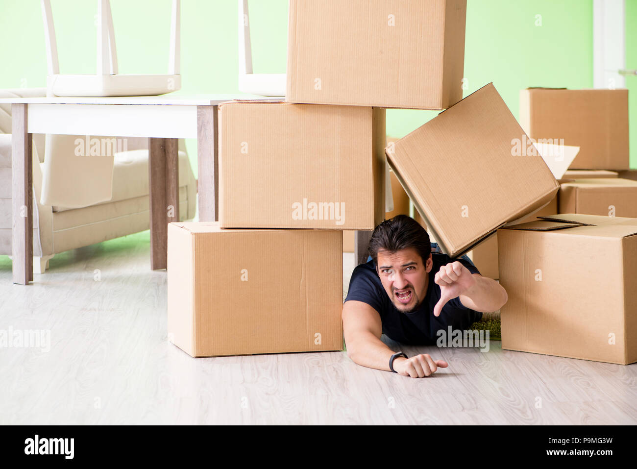 Man moving house with boxes Stock Photo - Alamy