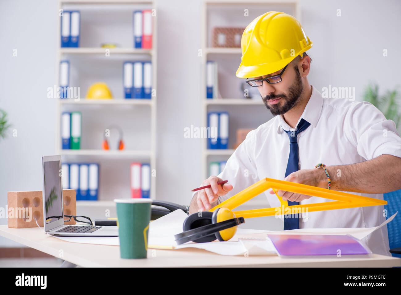 Architect working in his studio on new project Stock Photo - Alamy