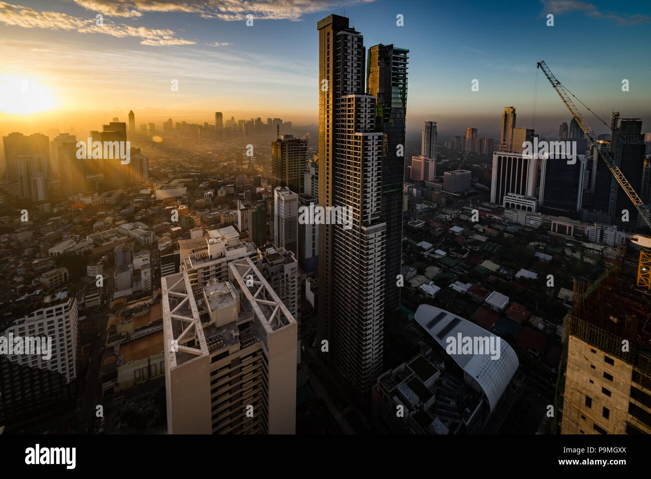 Beautiful Manila city at morning dawn with light rays passed through ...