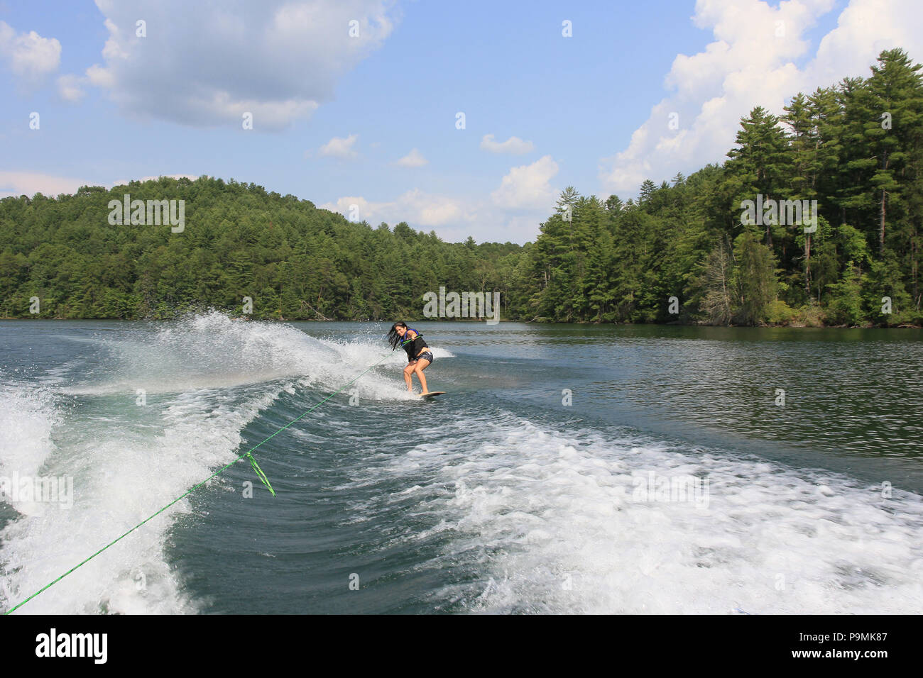 Young woman wakeboarding on Lake Santeetlah, North Carolina, United ...