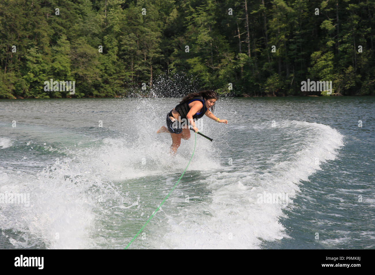 Young woman wakeboarding on Lake Santeetlah, North Carolina, United ...