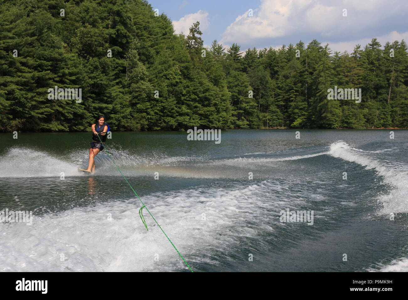 Young woman wakeboarding on Lake Santeetlah, North Carolina, United ...
