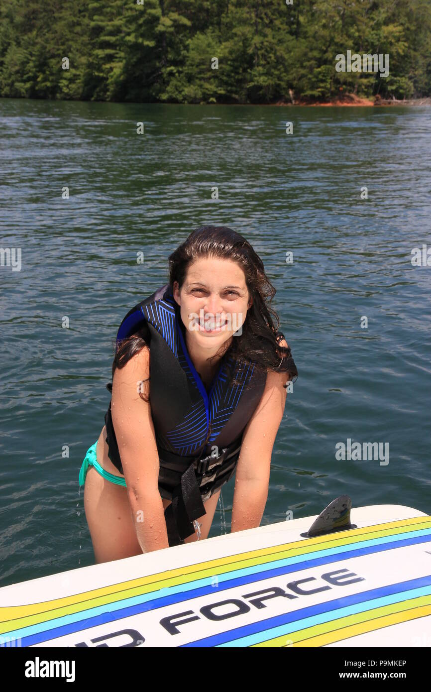 Young woman wakeboarding on Lake Santeetlah, North Carolina, United ...