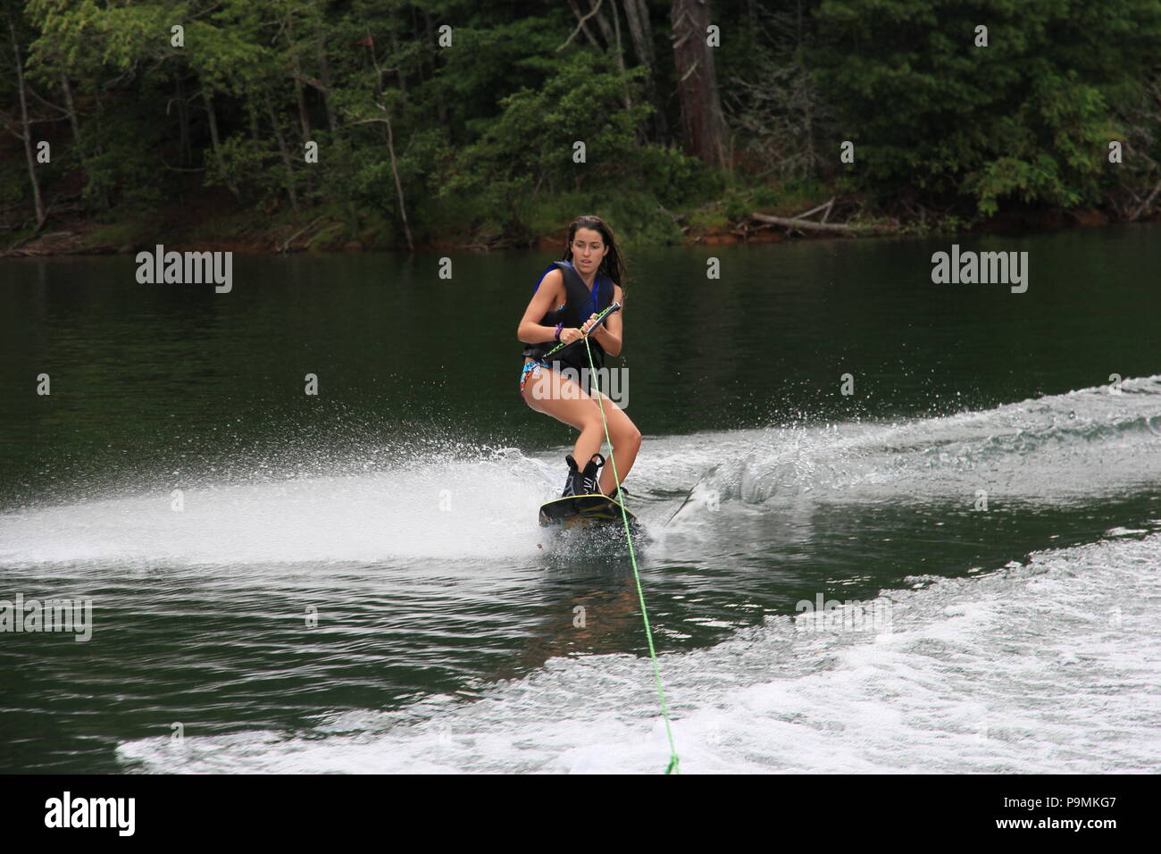 Young woman wakeboarding on Lake Santeetlah, North Carolina, United ...