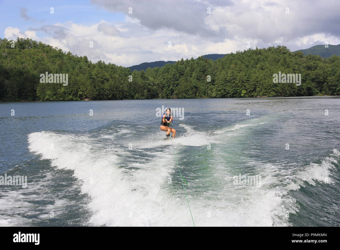 Young woman wakeboarding on Lake Santeetlah, North Carolina, United ...