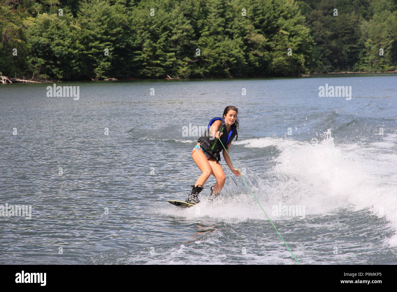 Young woman wakeboarding on Lake Santeetlah, North Carolina, United ...