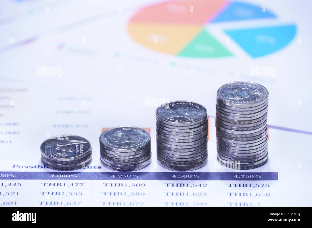 Coin stack on chart paper analysis , growth concept Stock Photo - Alamy