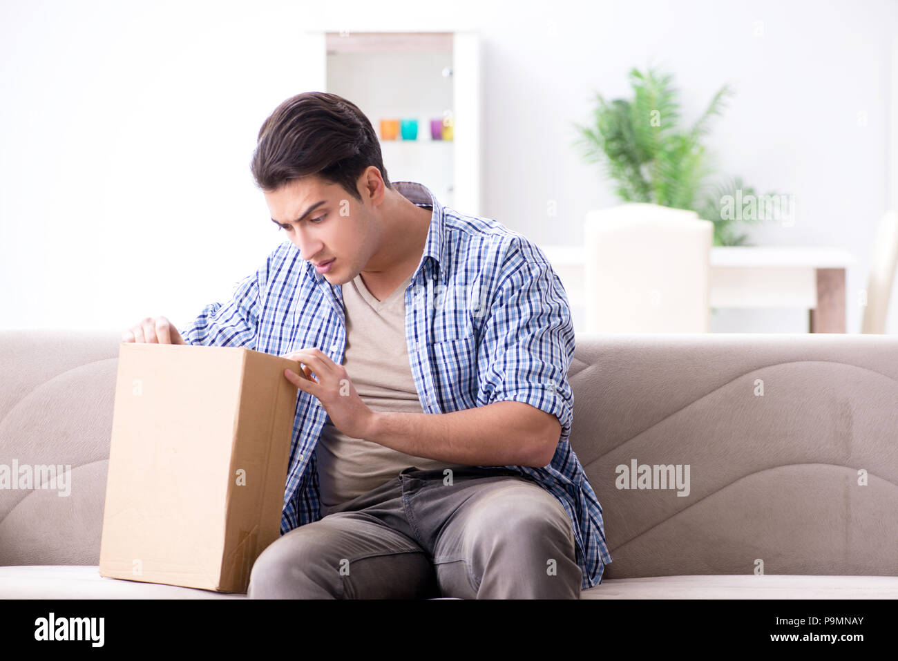 Man receiving empty parcel with stolen goods Stock Photo - Alamy