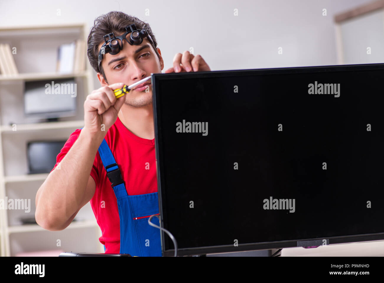 Professional repair engineer repairing broken tv Stock Photo - Alamy