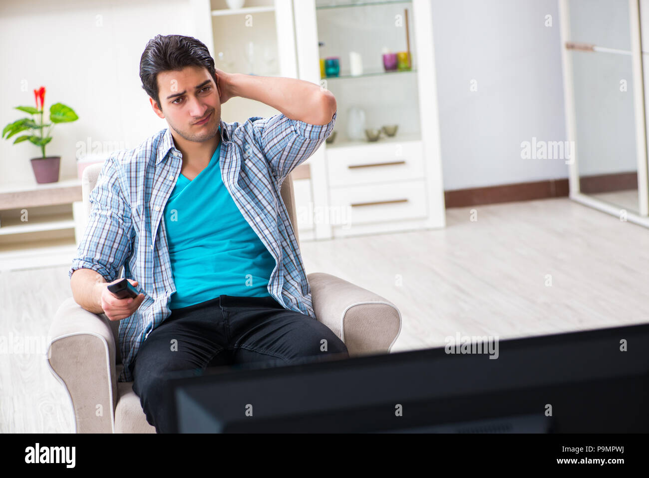 Lazy man television frustrated hi-res stock photography and images - Alamy