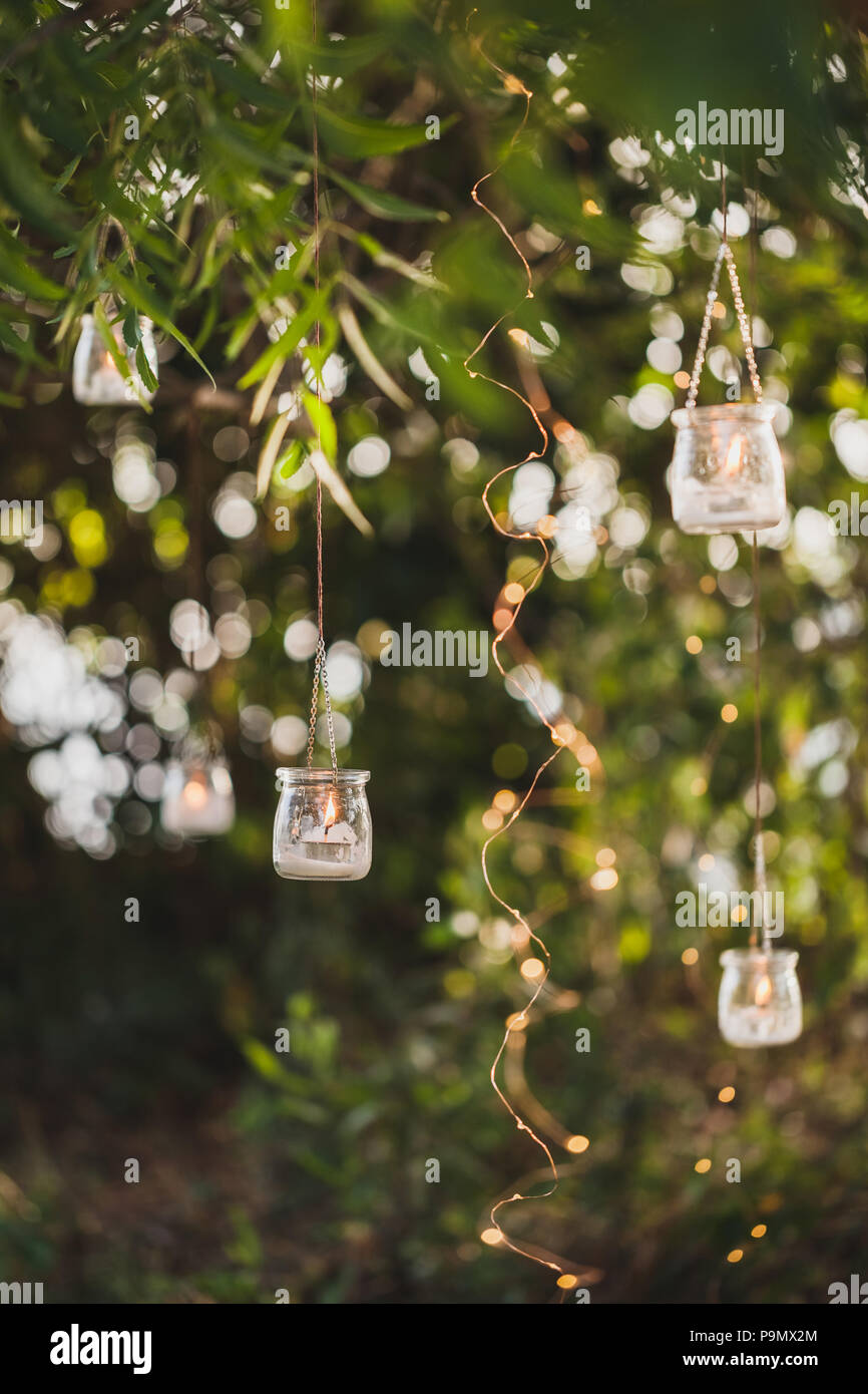 Night wedding ceremony with a lot of vintage lamps and candles on big ...