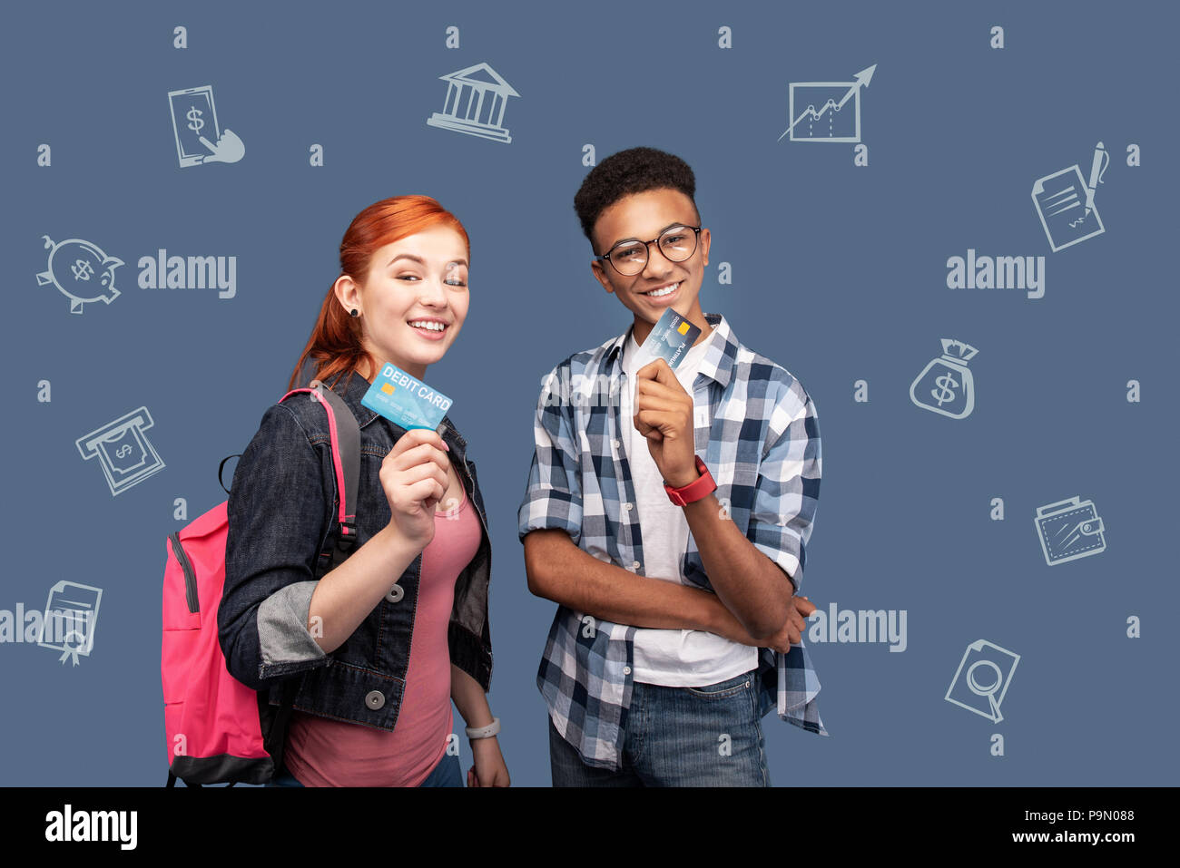 Happy students smiling while having their first credit cards Stock ...