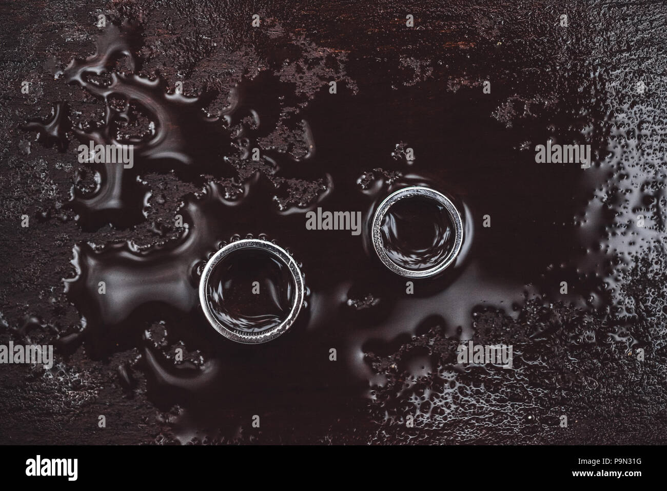 Wedding rings on water surface texture Stock Photo - Alamy