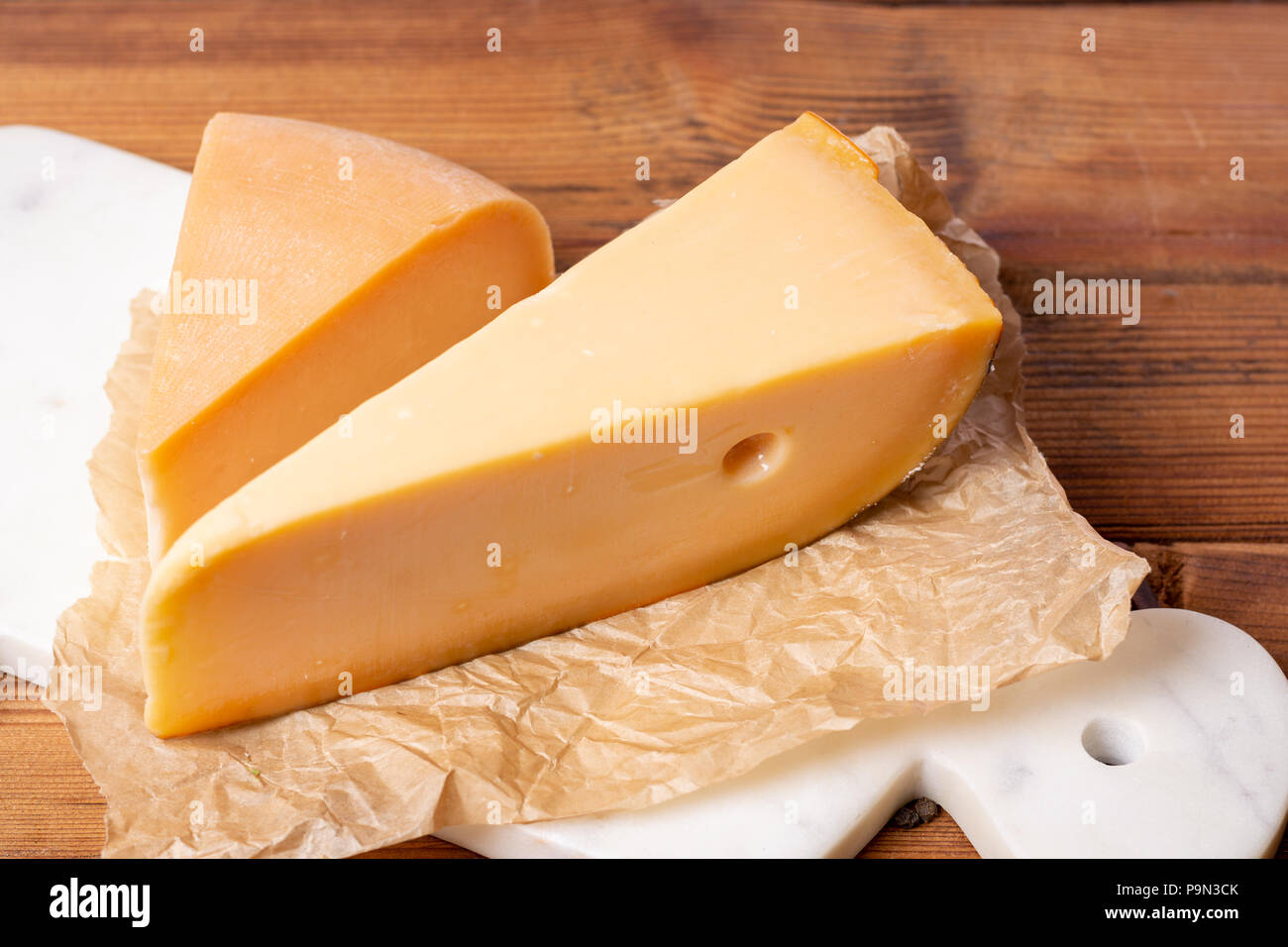 Dutch old cheeses, made from cow and goat milk on wooden table Stock ...