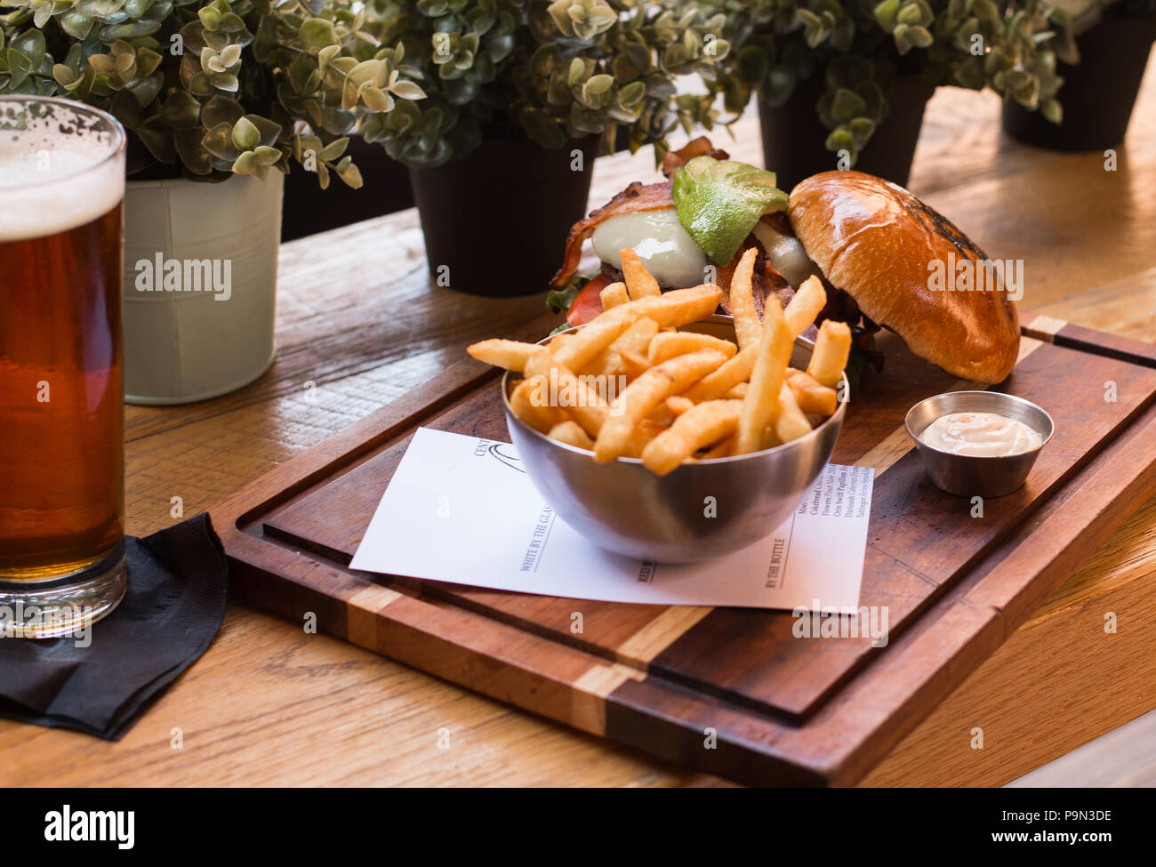 Delicious Hamburger, Fries and a Beer Stock Photo - Alamy