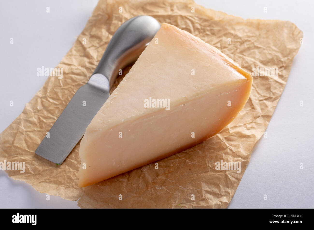 Dutch old Amsterdam cheese, made from goat milk on white background ...