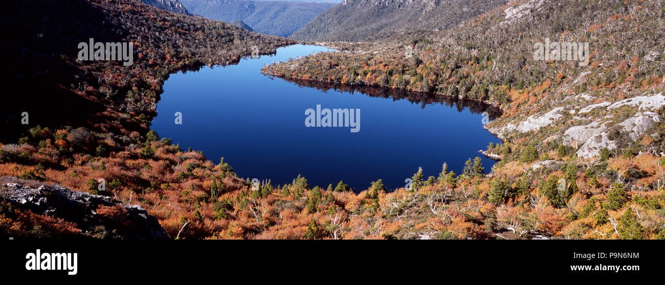 Deciduous beech lines the shores of symmetrical Lake Hanson Stock Photo ...