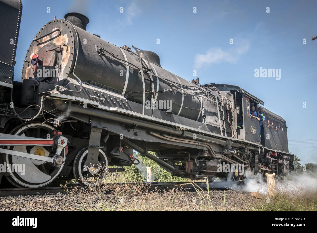 A Garratt steam locomotive crossing the Victoria Falls Bridge. Zimbabwe ...