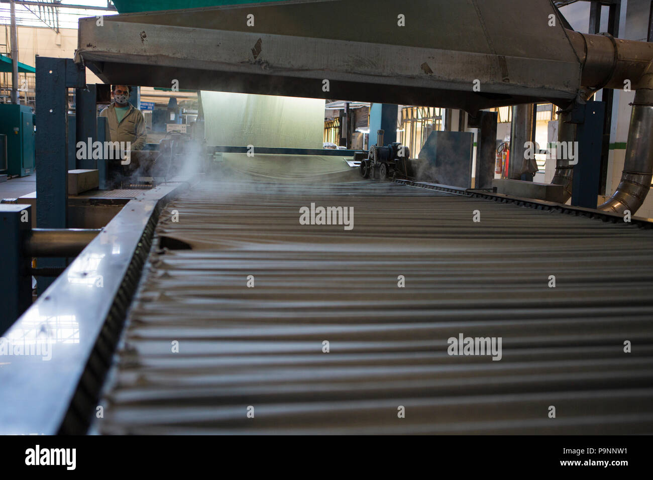 Organic cotton being dyed at a garment factory, where organic cotton is ...