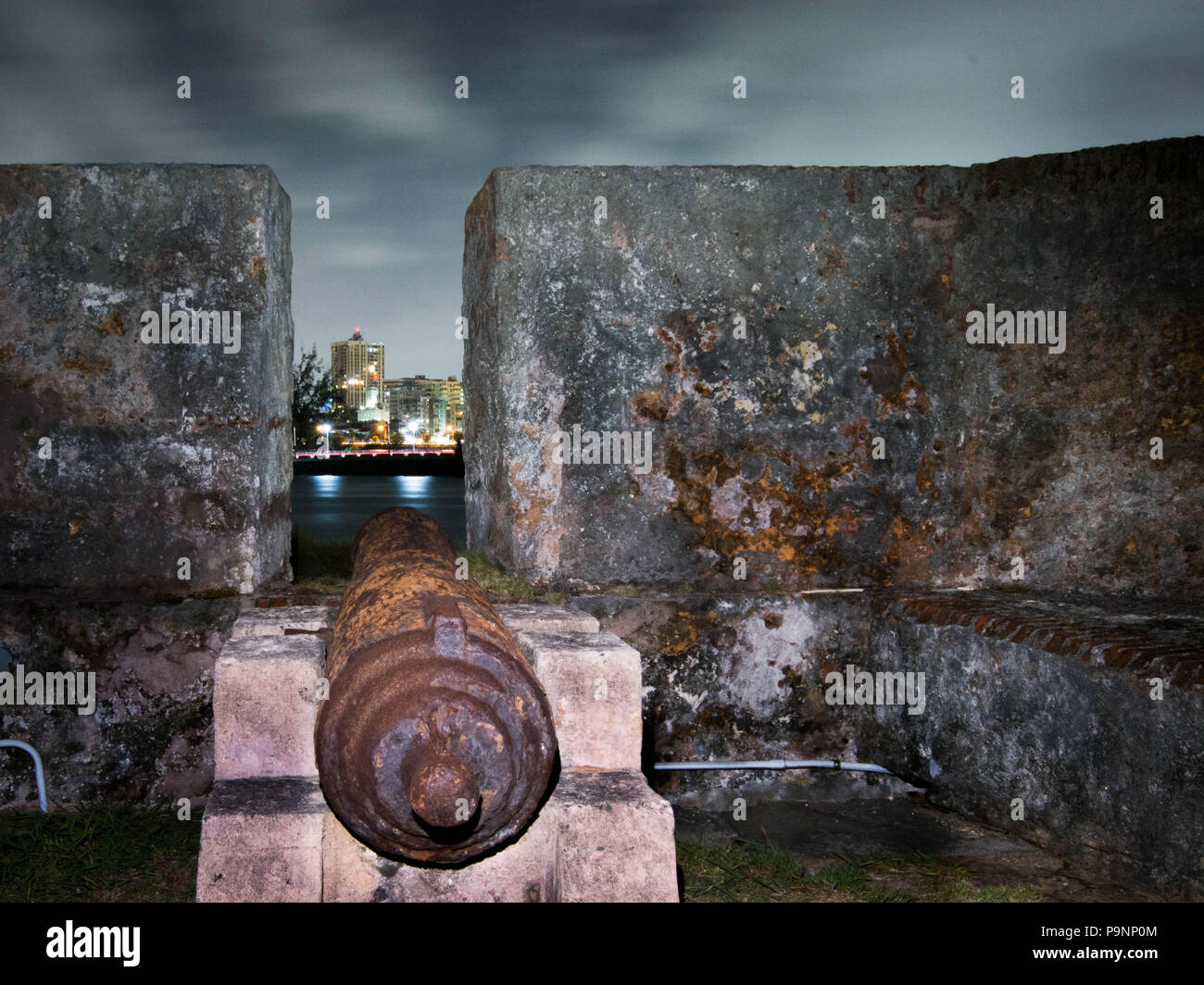 An old spanish cannon overlooking the lagoon and the buildings of San ...
