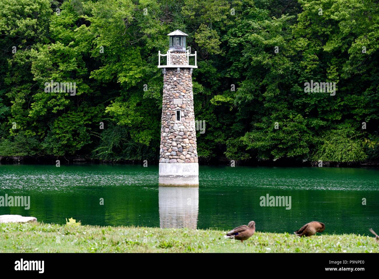 Lighthouse in the middle of a pond Stock Photo - Alamy