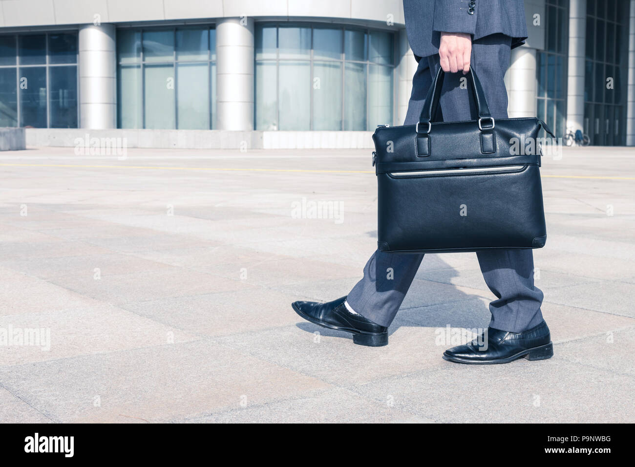 Businessman carrying a briefcase hi-res stock photography and images ...