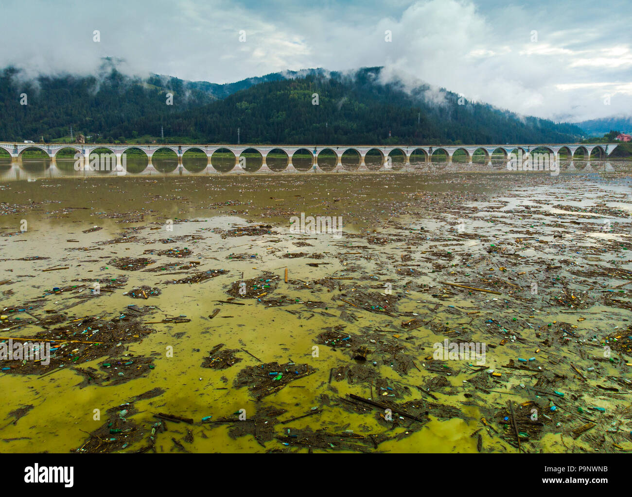 lake water pollution with plastic bags and dirt Stock Photo - Alamy