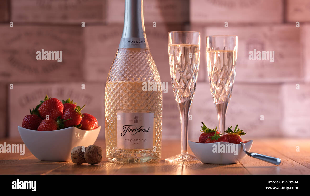 Prosecco and Strawberries cut crystal glasses flower wallpaper wooden ...