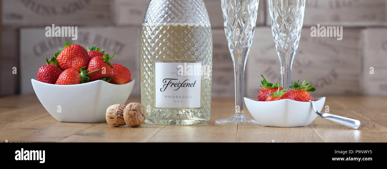 Prosecco and Strawberries cut crystal glasses flower wallpaper wooden ...