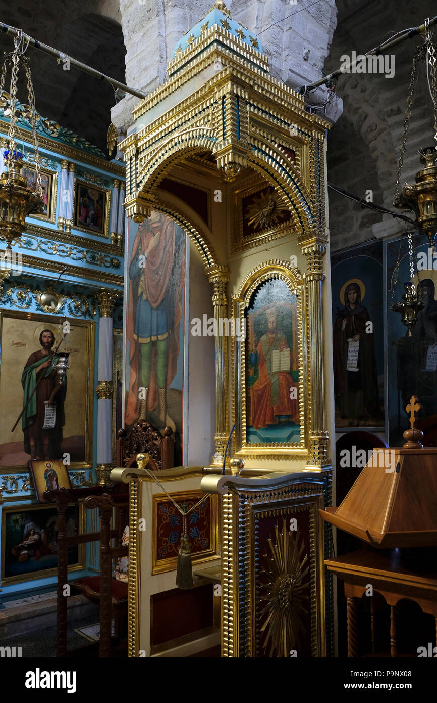 A decorated cathedra or bishop's throne inside the Church of St ...