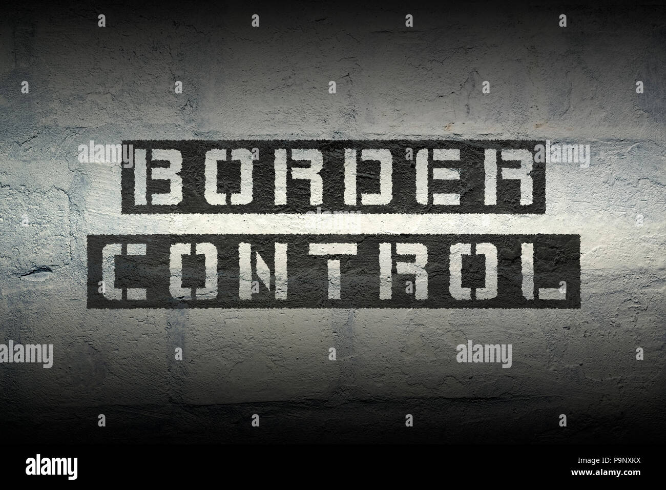 border control stencil print on the grunge white brick wall Stock Photo ...