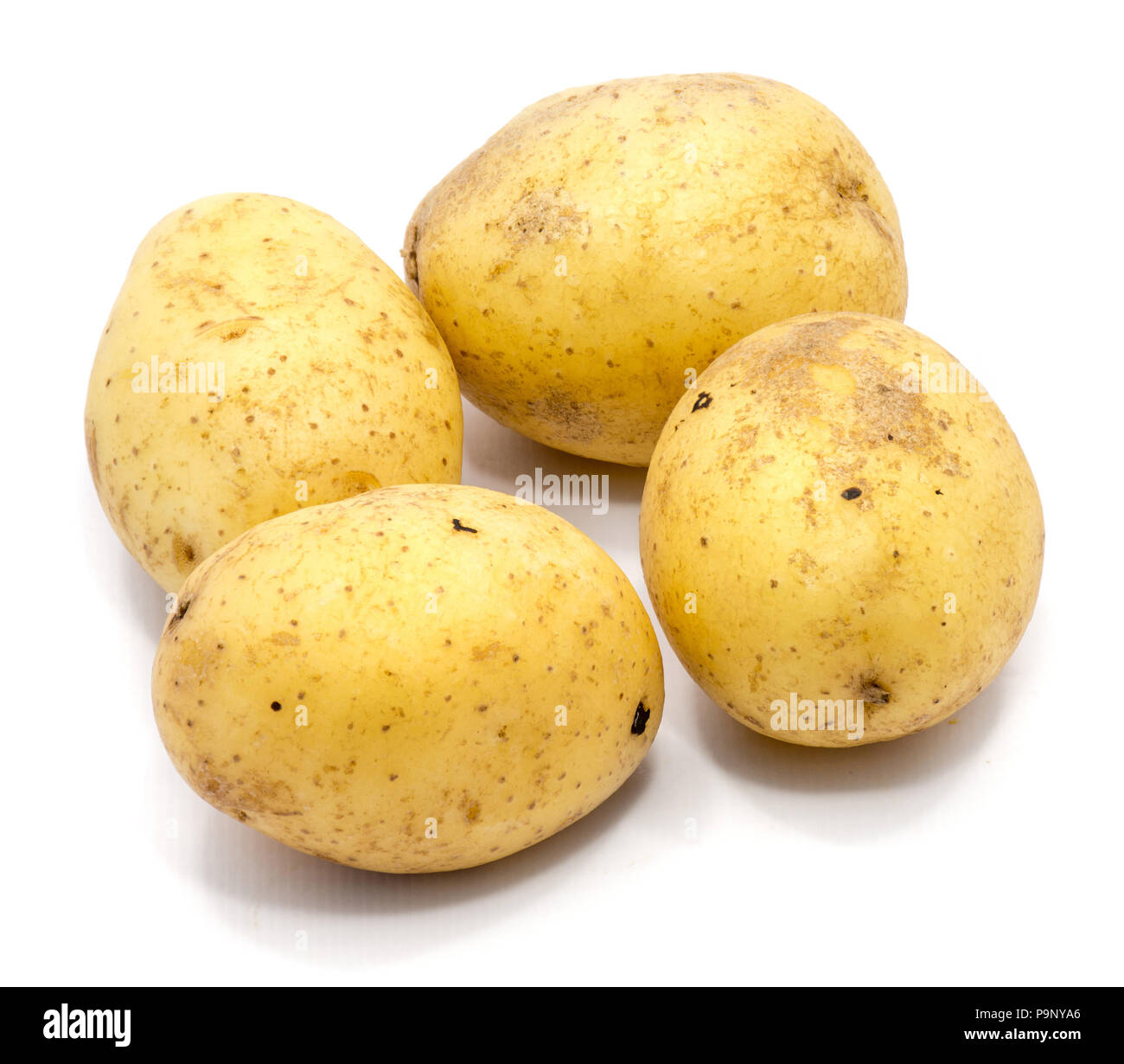 Four whole potatoes isolated on white background Stock Photo - Alamy