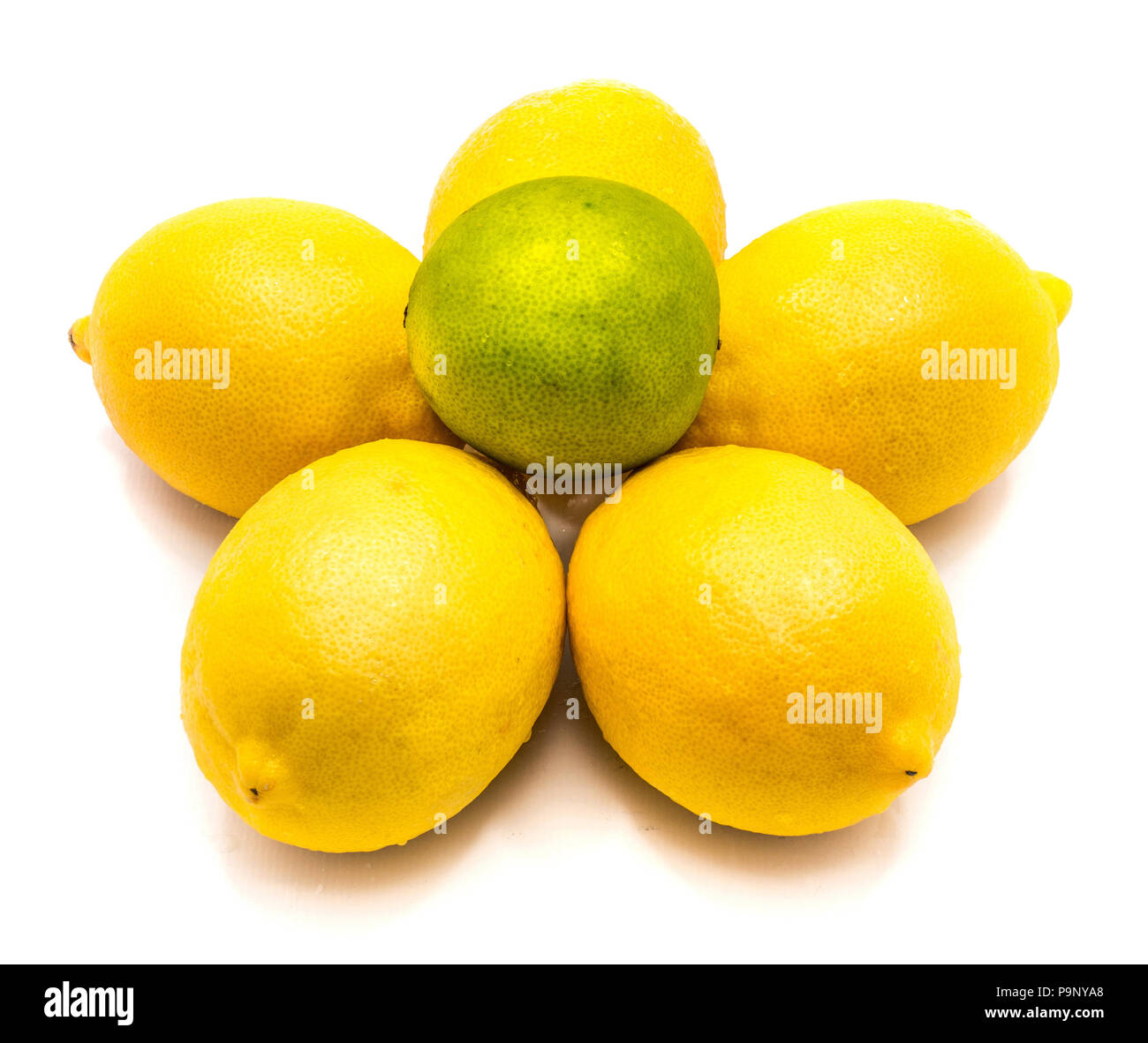 Group of several whole lemons and one lime in centre like a flower ...