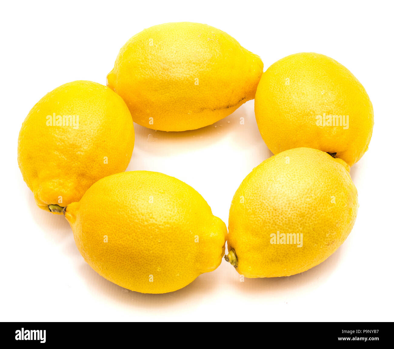 Group of five whole yellow lemons in round isolated on white background ...