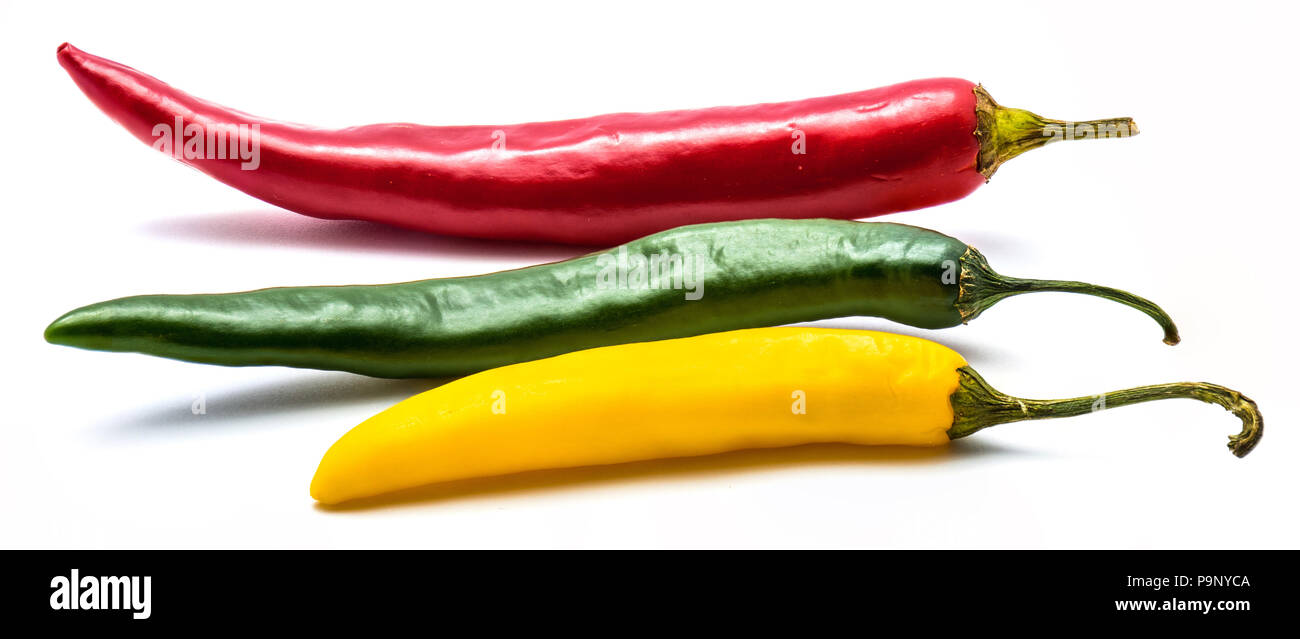 Red, green and yellow Cayenne Chili peppers isolated on white ...