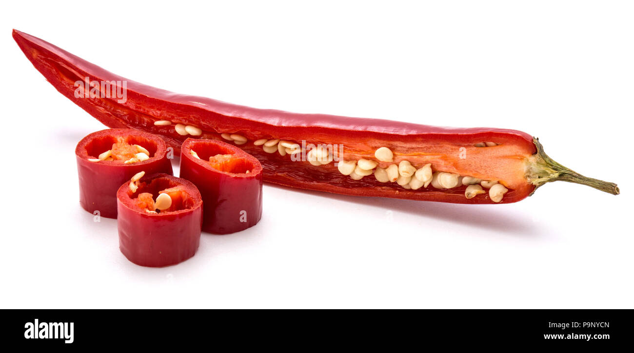 One half of red Chili pepper and three slices isolated on white ...