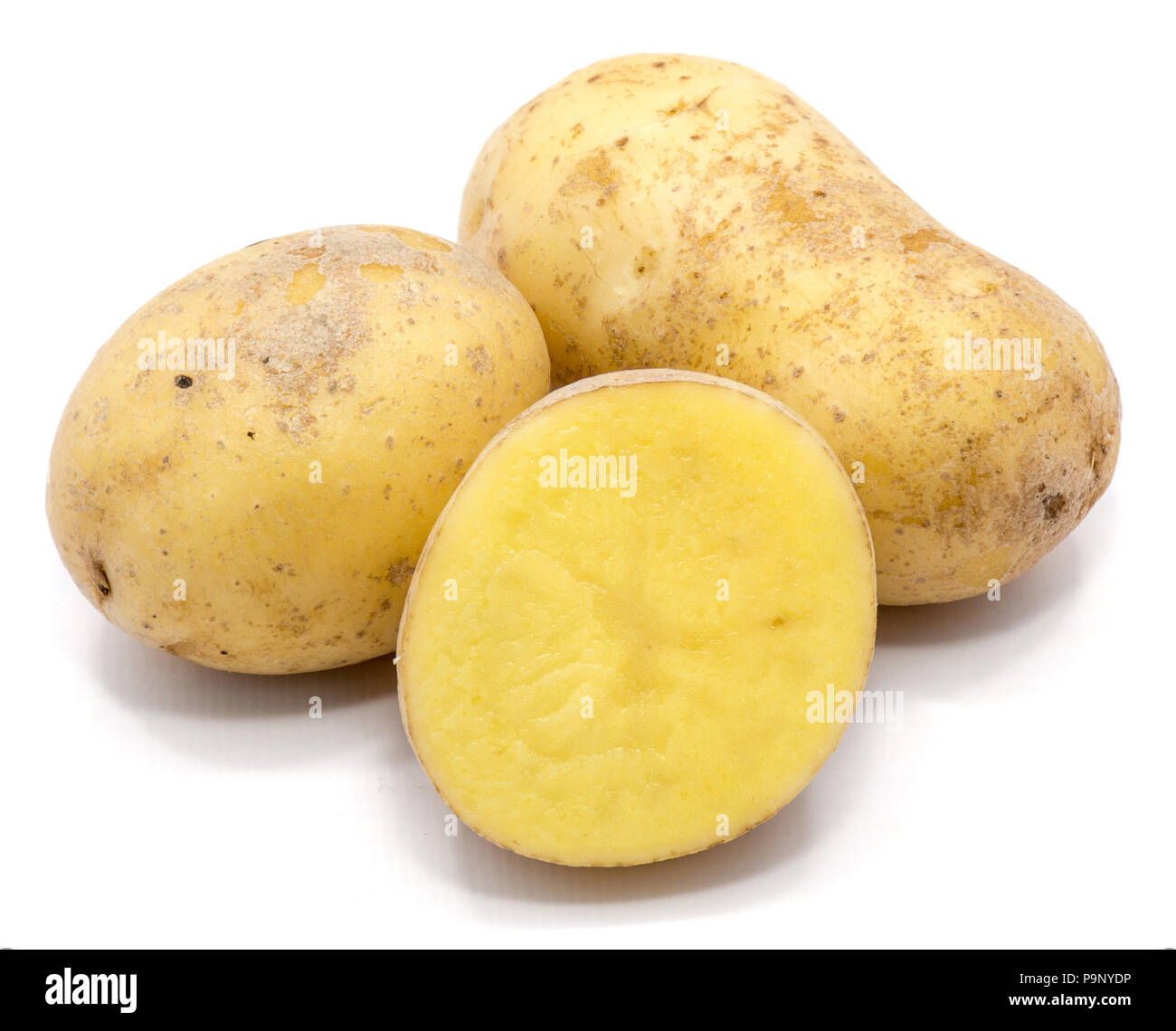 Two whole potatoes and a half isolated on white background Stock Photo ...