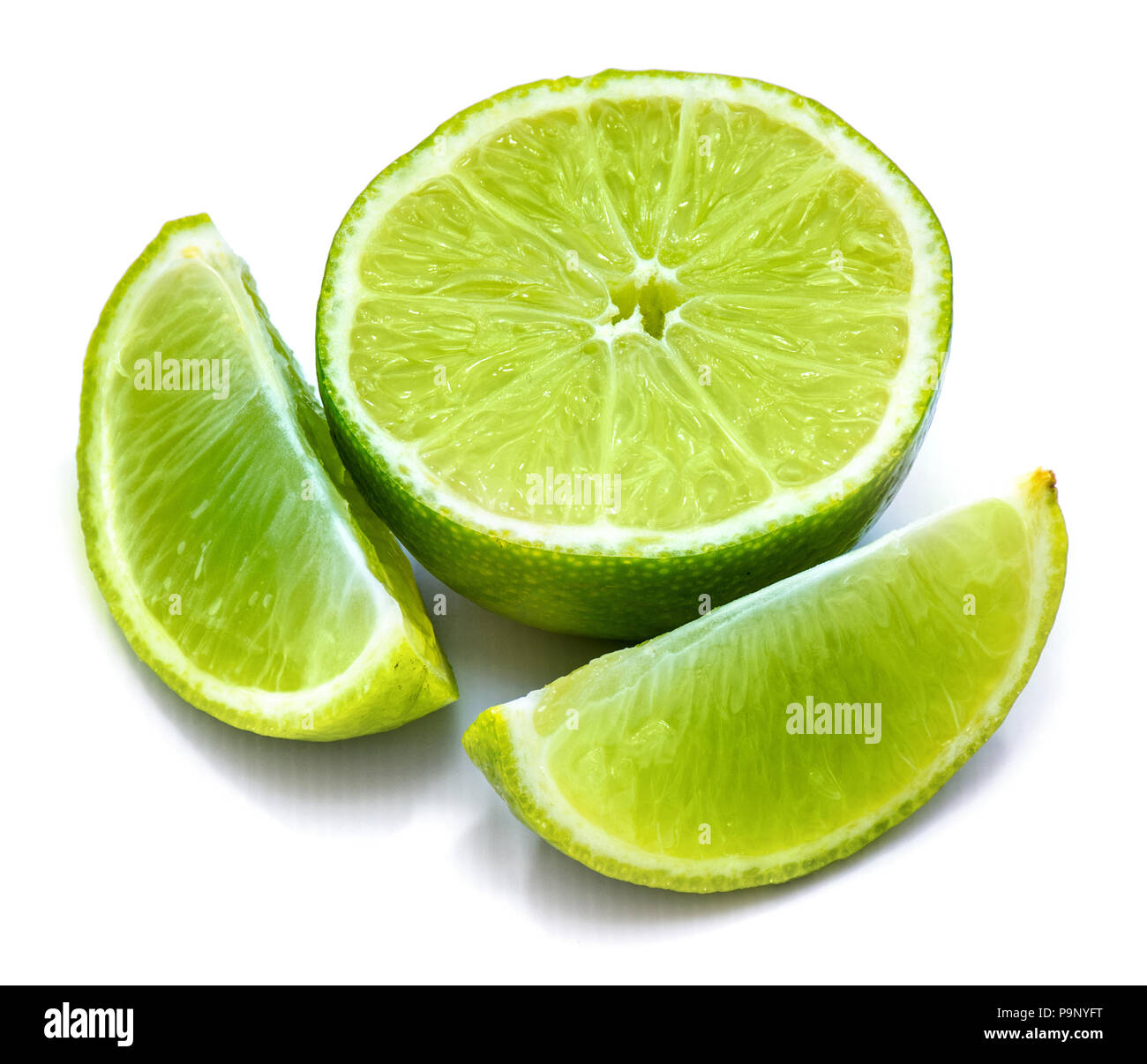 One lime half and two slices isolated on white background Stock Photo ...