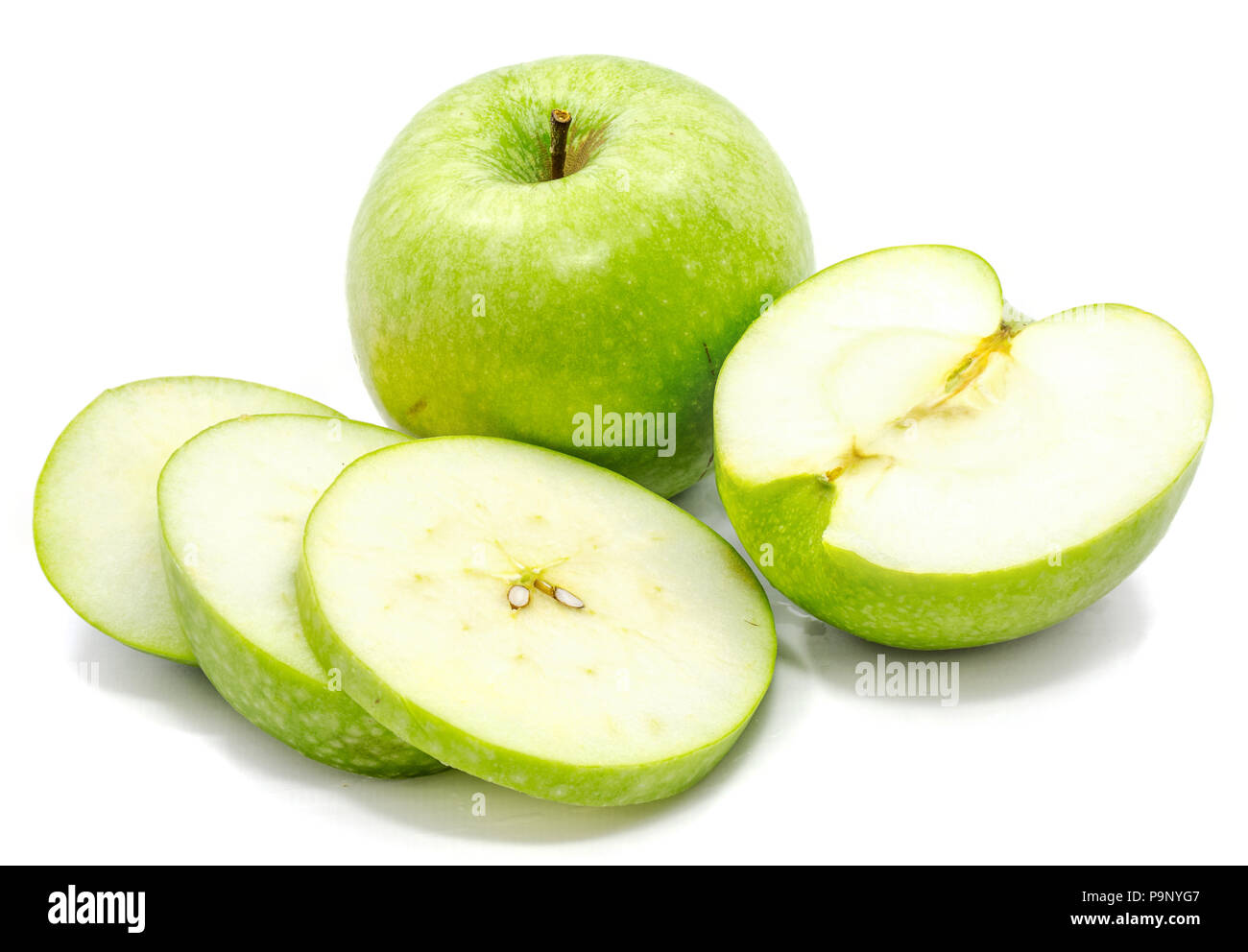 Sliced Granny Smith apples, one whole apple, one half and circles ...