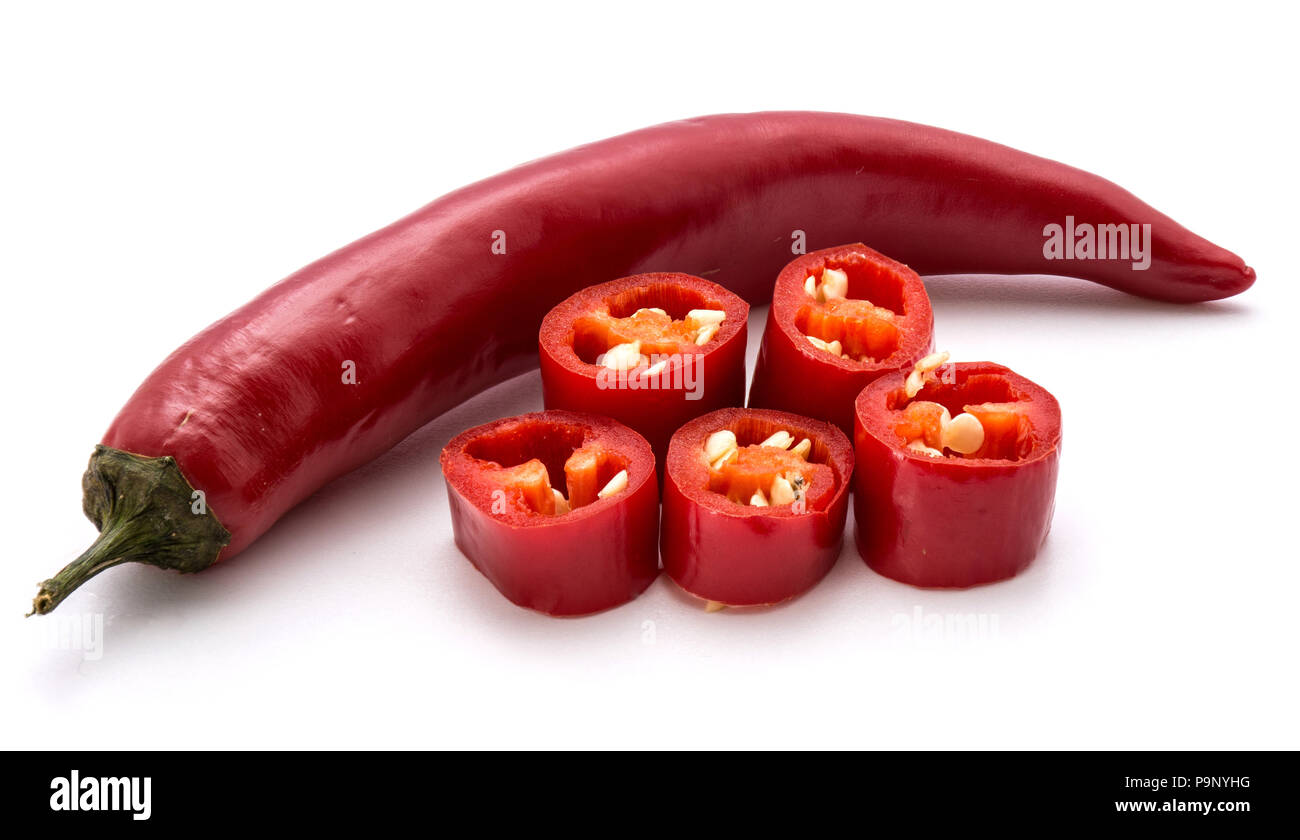 One whole red Chili pepper with five slices isolated on white ...