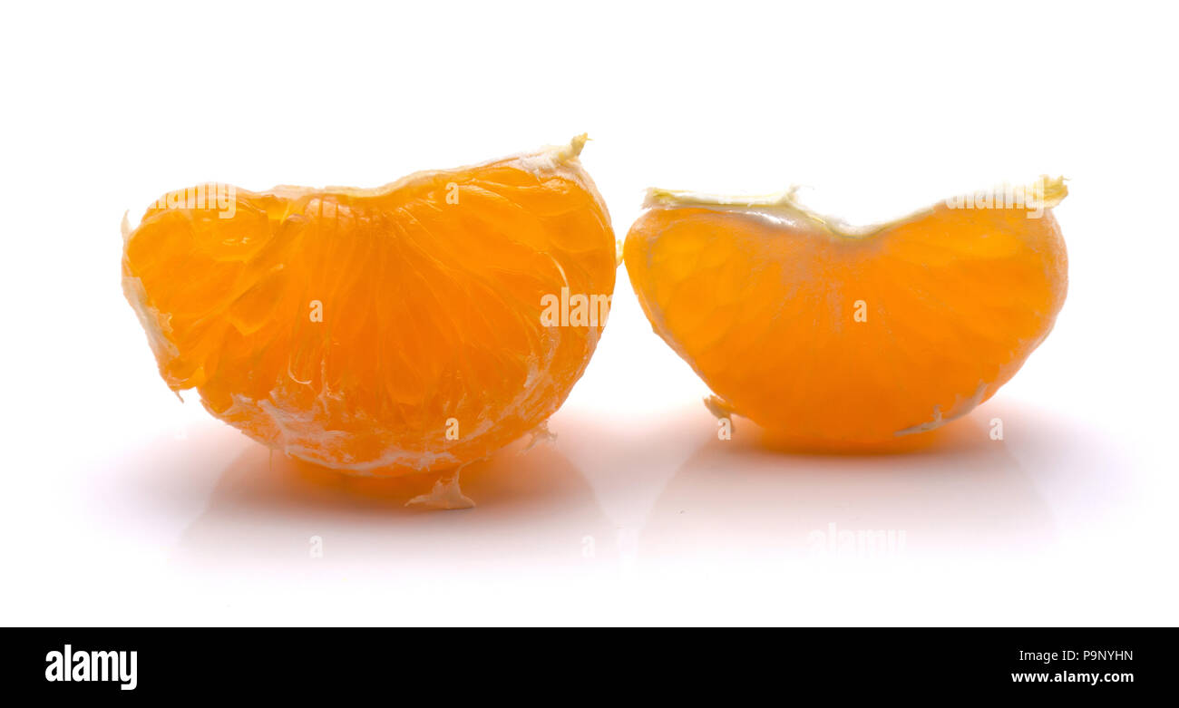 Tangerine segments isolated on white background two pieces comparing ...