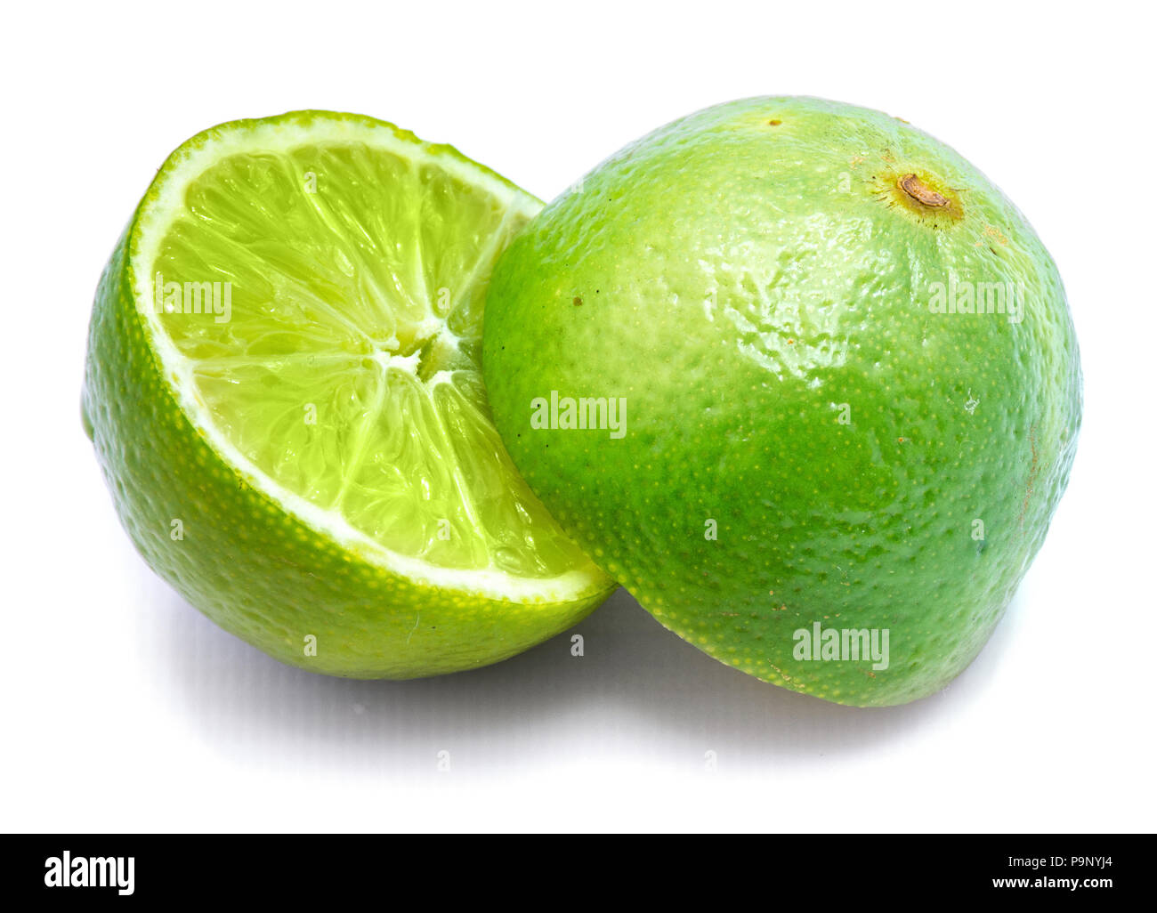 Two lime halves, sliced, isolated on white studio background Stock ...
