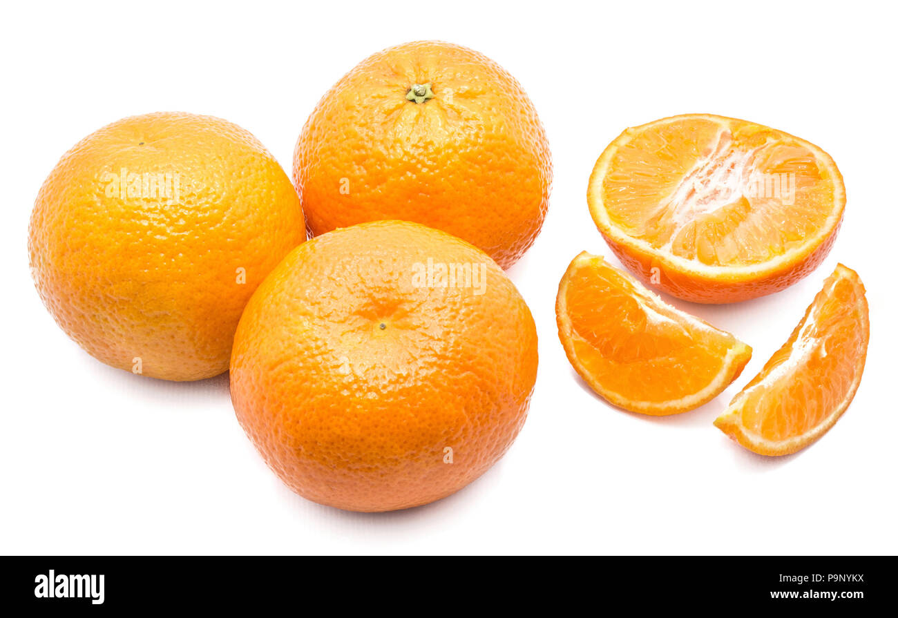 Three whole Clementines, one half and two slices isolated on white ...