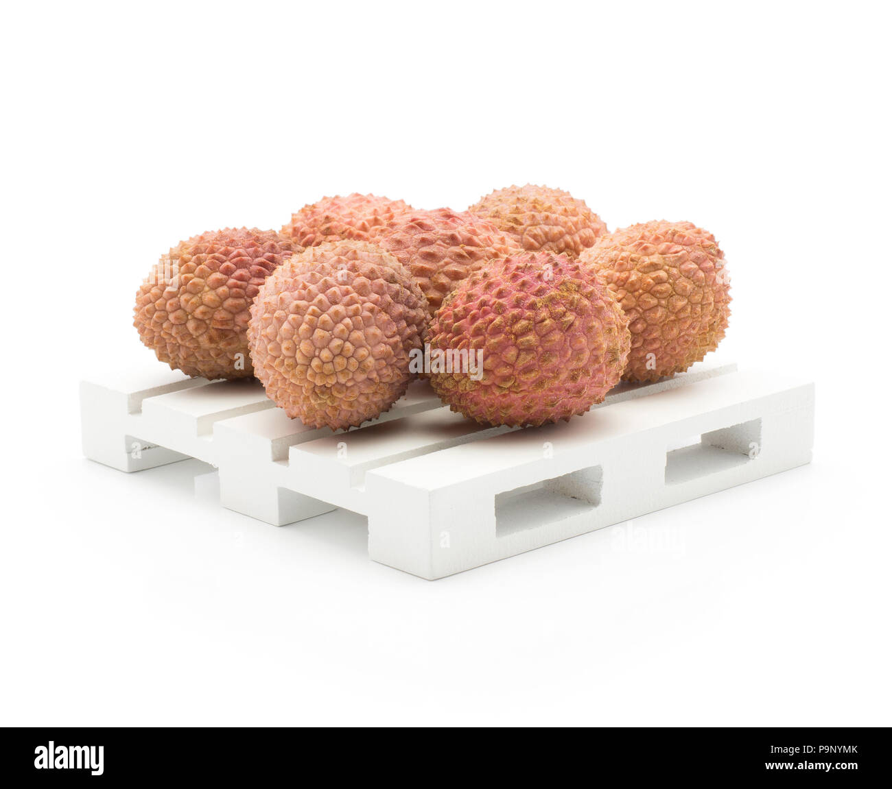 Lychee on pallet isolated on white background ripe pink fresh berries ...