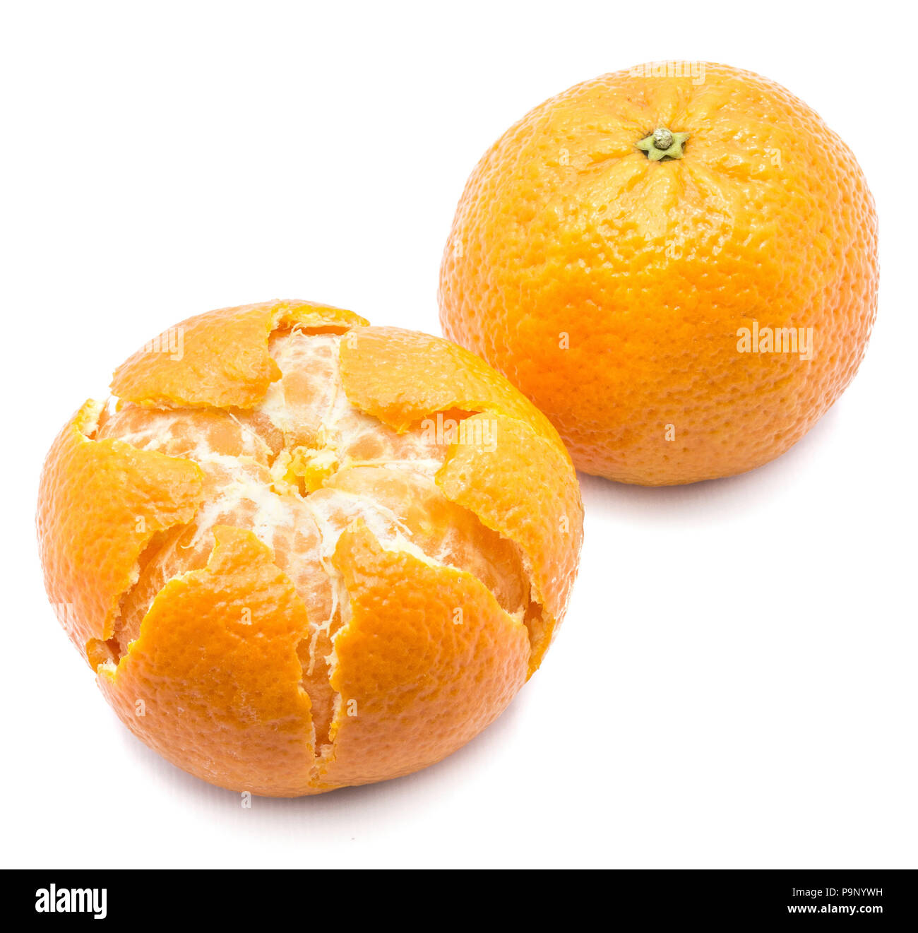 Pair of peeled and unpeeled Clementines isolated on white background ...