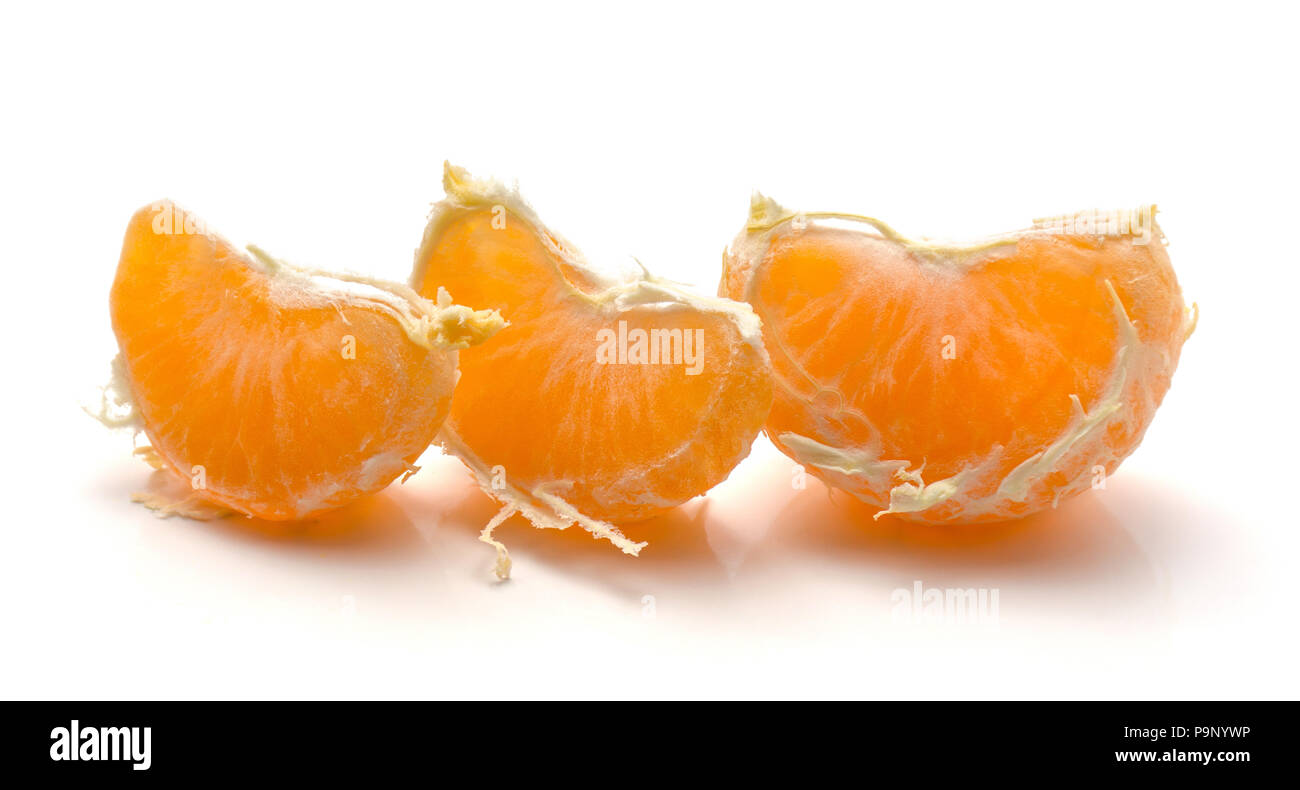 Three separated tangerine segments isolated on white background Stock ...
