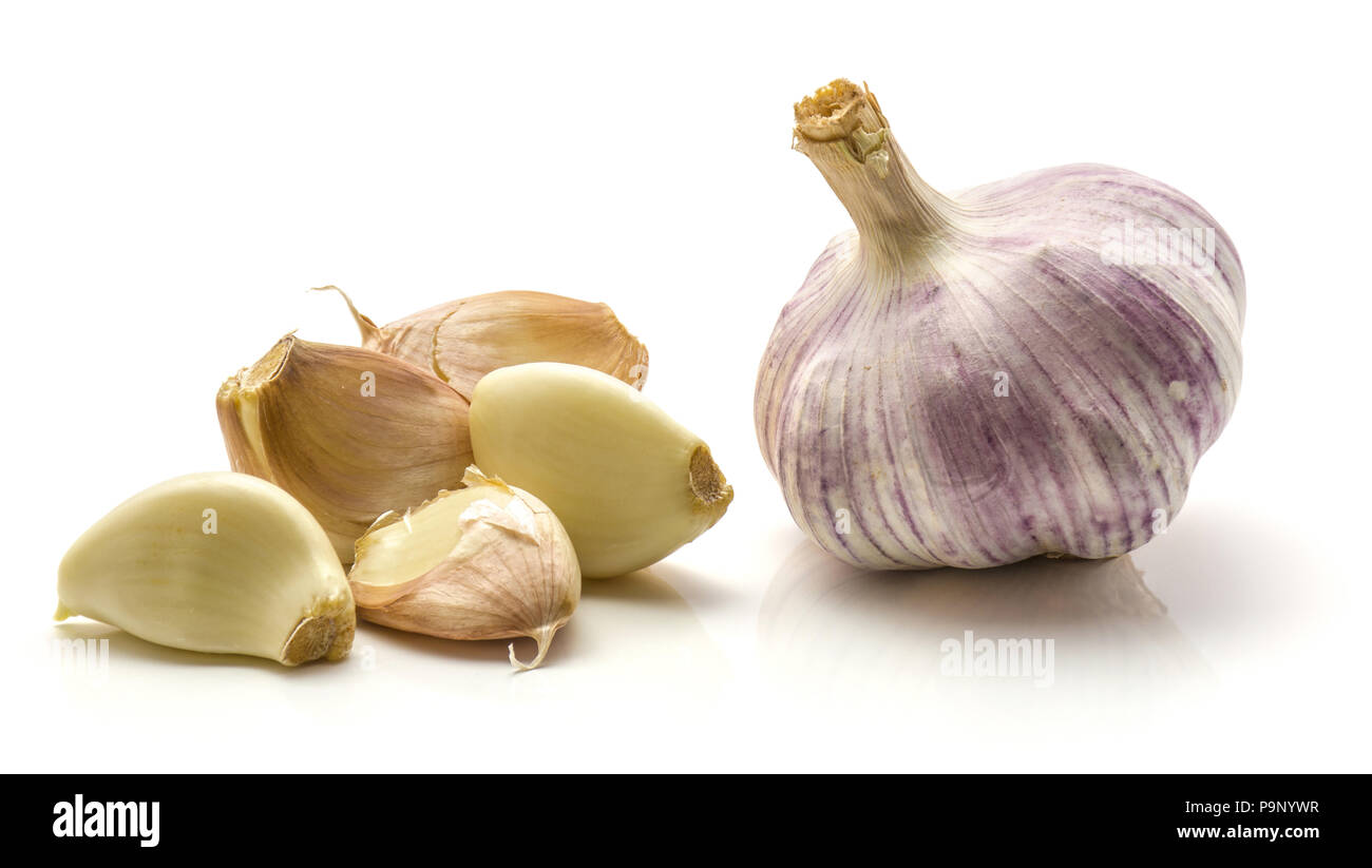 One whole garlic bulb and separated cloves isolated on white background ...