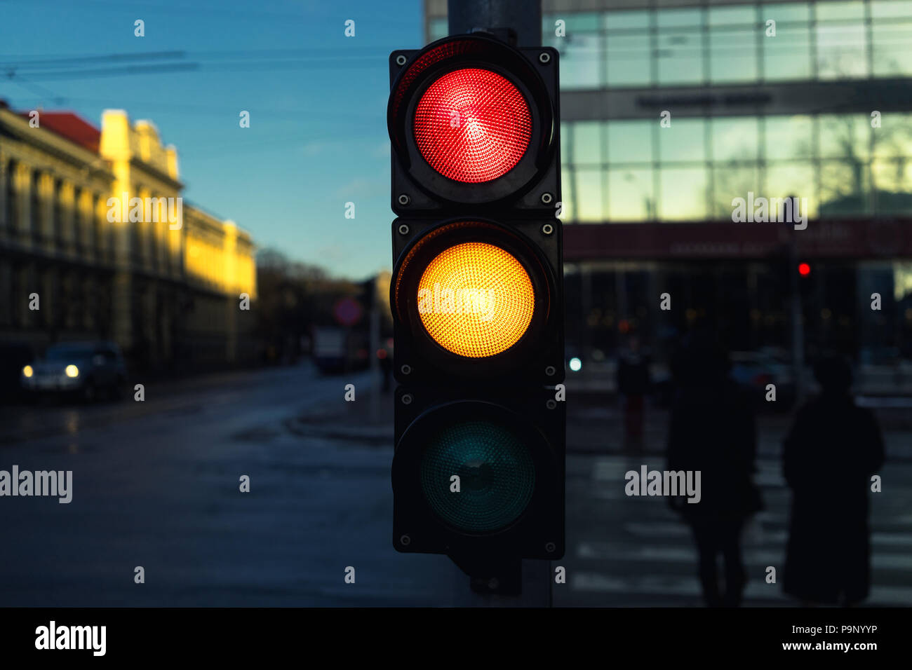 Traffic lights at an intersection at a pedestrian crossing on a winter ...