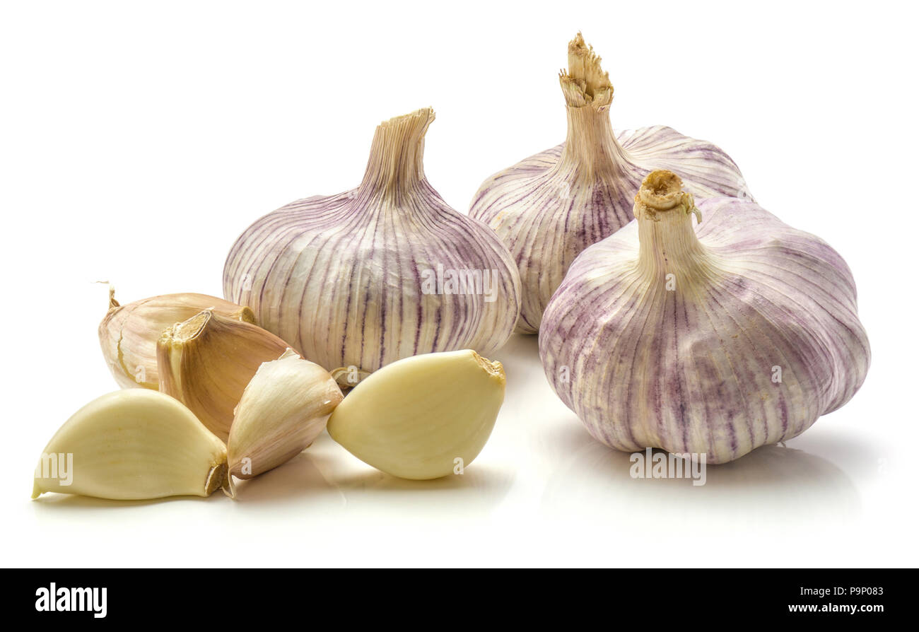 Three whole garlic bulbs and separated cloves isolated on white ...